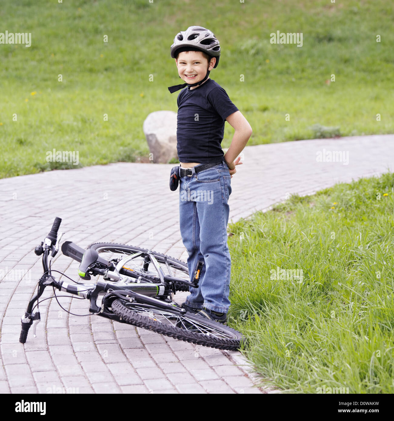 Smiling boy and bike Stock Photo - Alamy