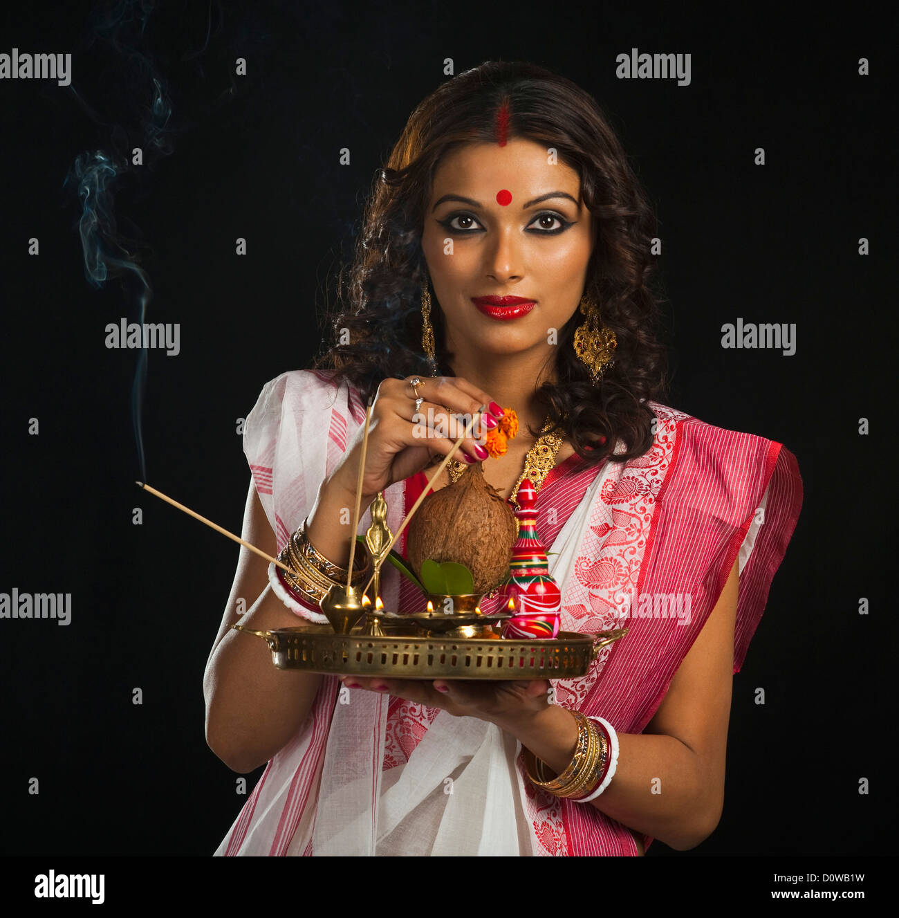 Bengali woman holding a pooja thali Stock Photo - Alamy