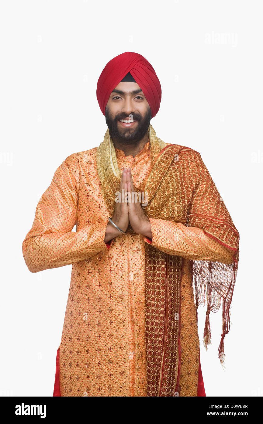 Sikh man greeting with smile Stock Photo - Alamy