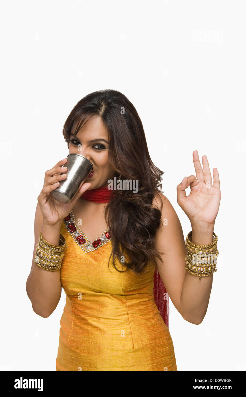 Woman drinking lassi the traditional Indian beverage Stock Photo - Alamy
