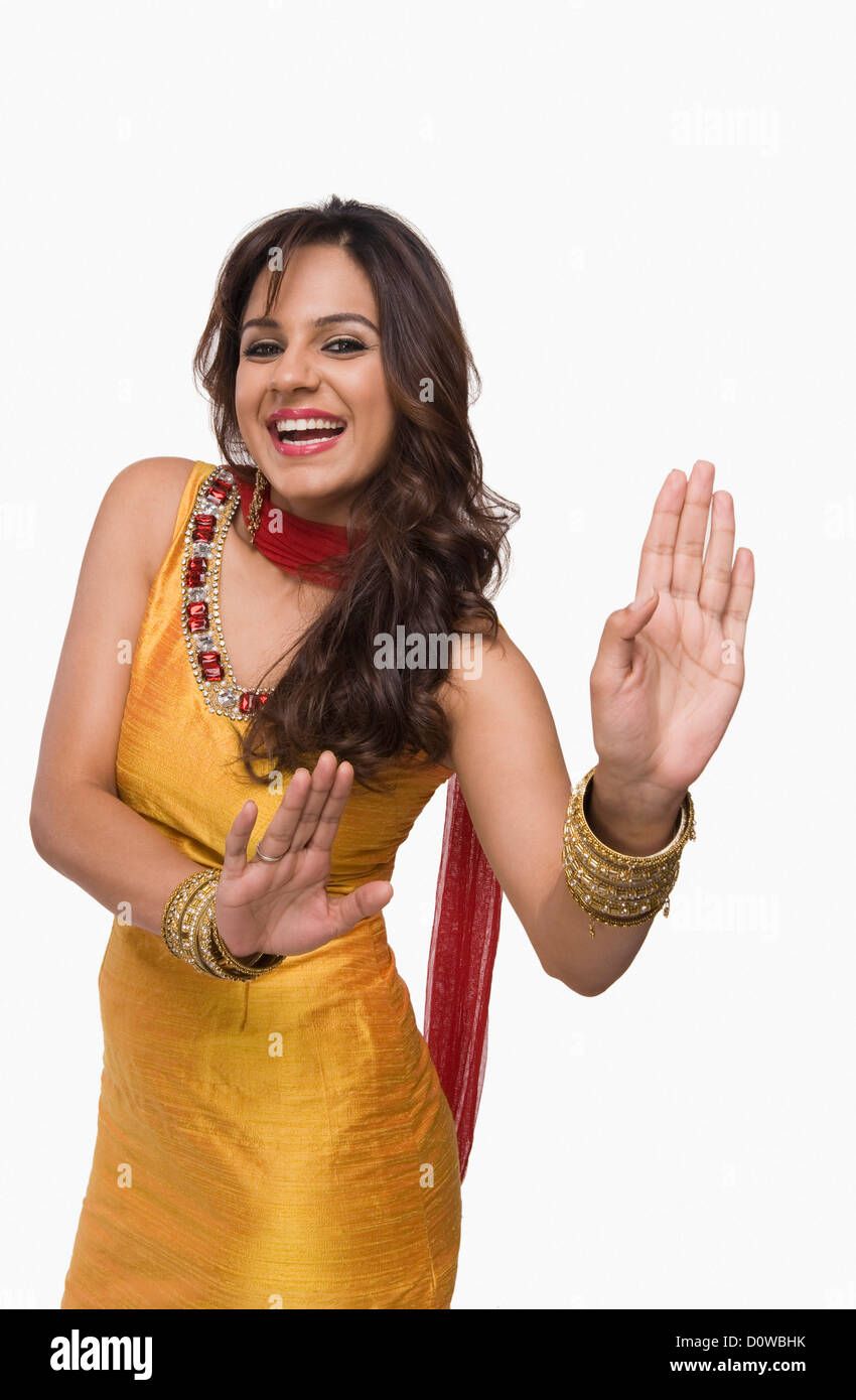Portrait of a woman doing Bhangra the folk dance of Punjab in India ...
