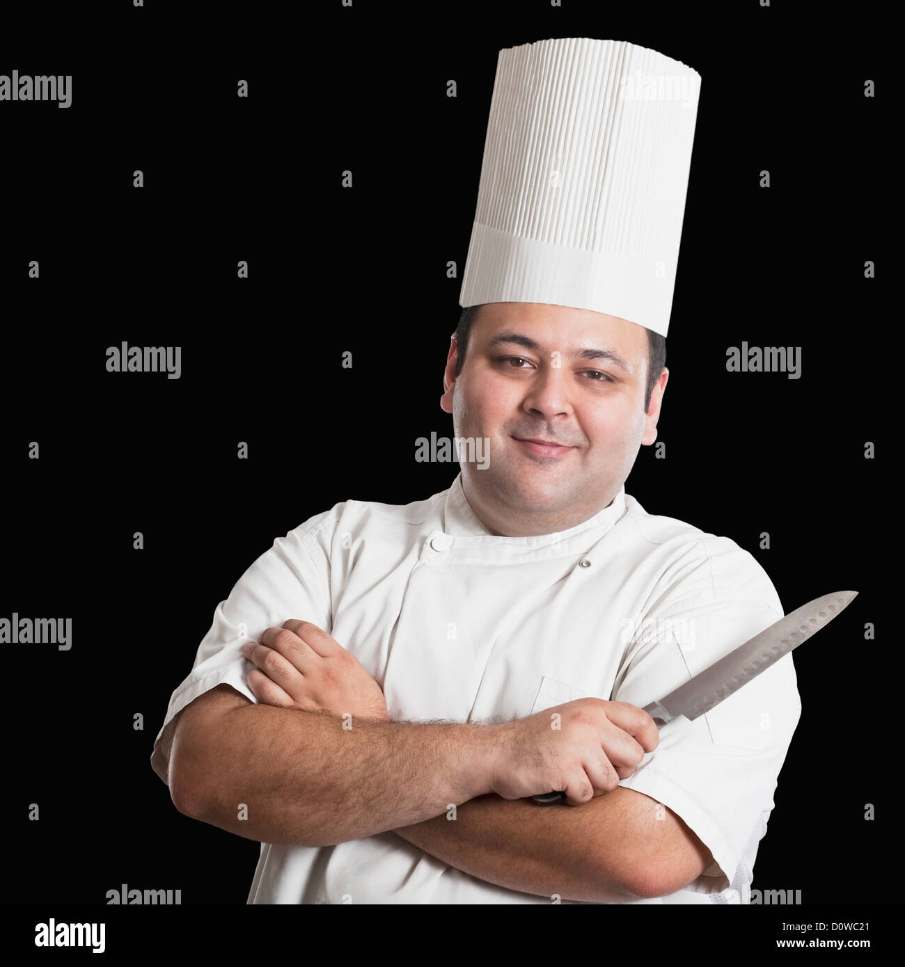 Portrait of a chef holding a knife Stock Photo - Alamy