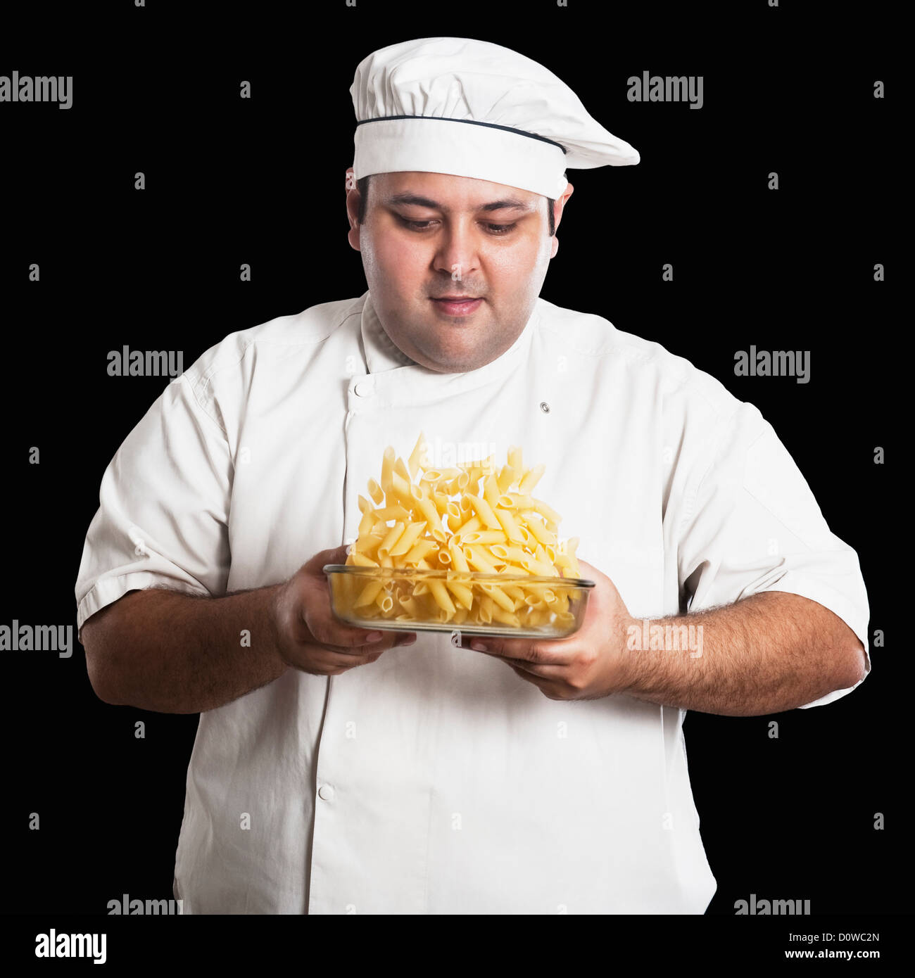 Chef holding a bowl of penne pasta Stock Photo - Alamy