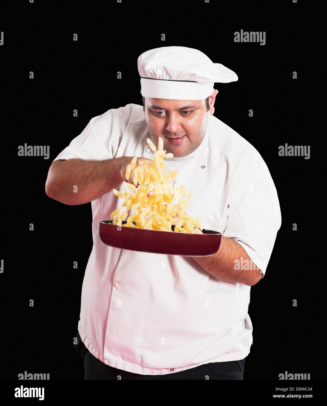 Chef cooking penne pasta Stock Photo - Alamy