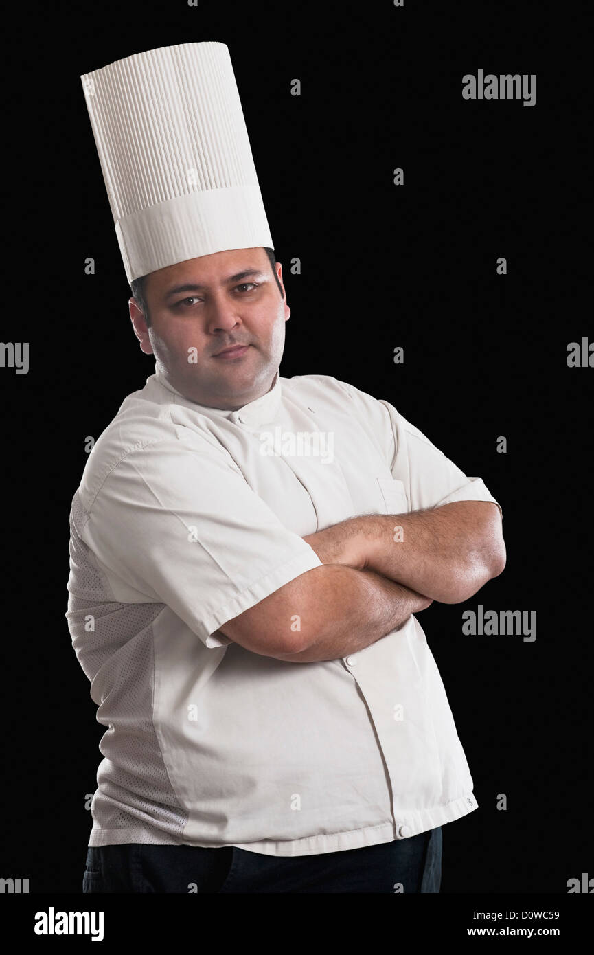 Portrait of a chef standing with his arms crossed Stock Photo - Alamy