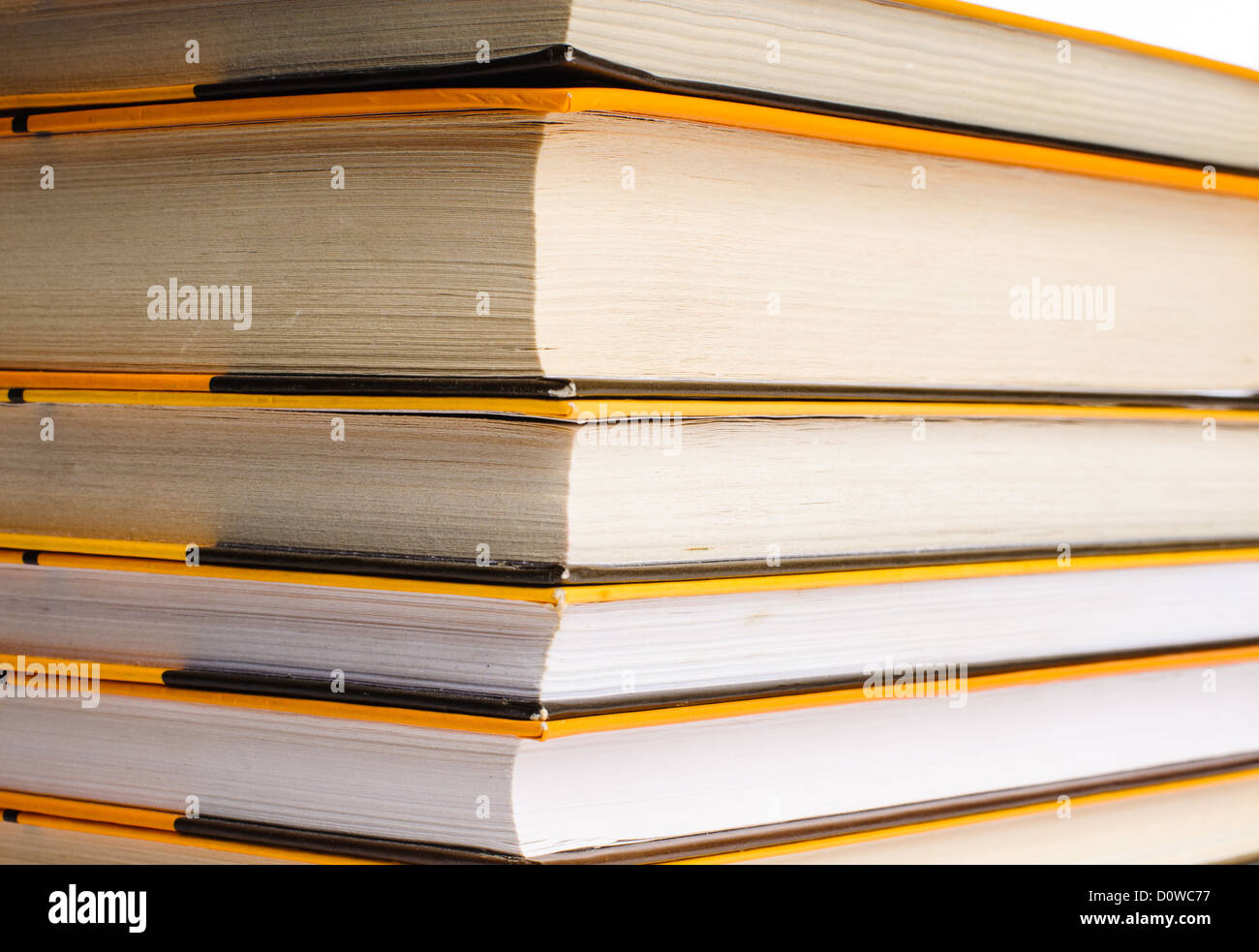 Big stack of yellow books isolated on white background Stock Photo - Alamy