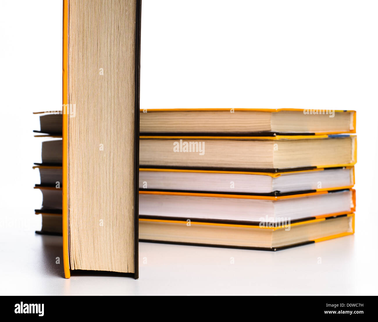 Big stack of yellow books isolated on white background Stock Photo - Alamy