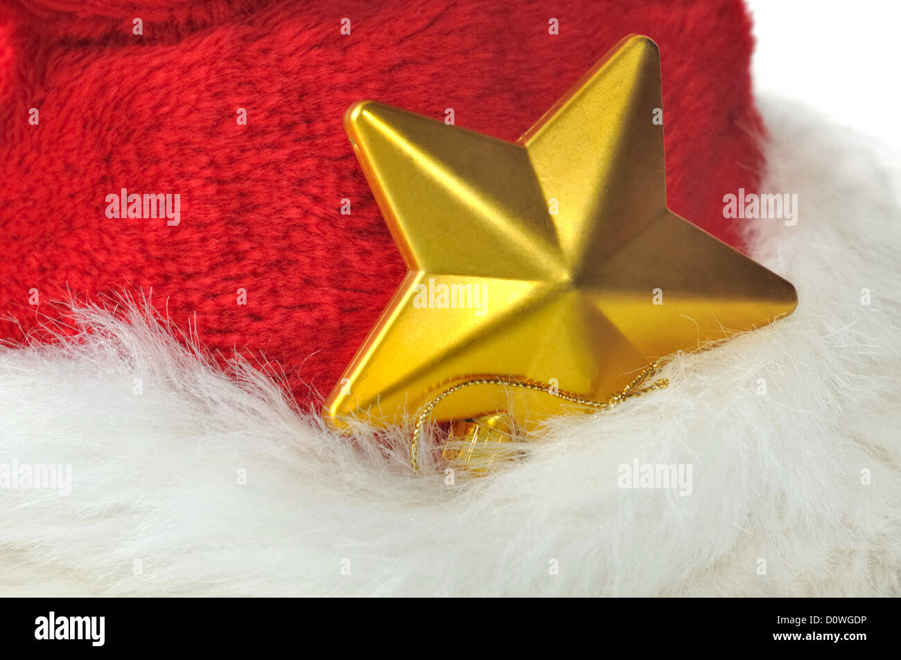 golden star in fur of santa claus cap Stock Photo - Alamy