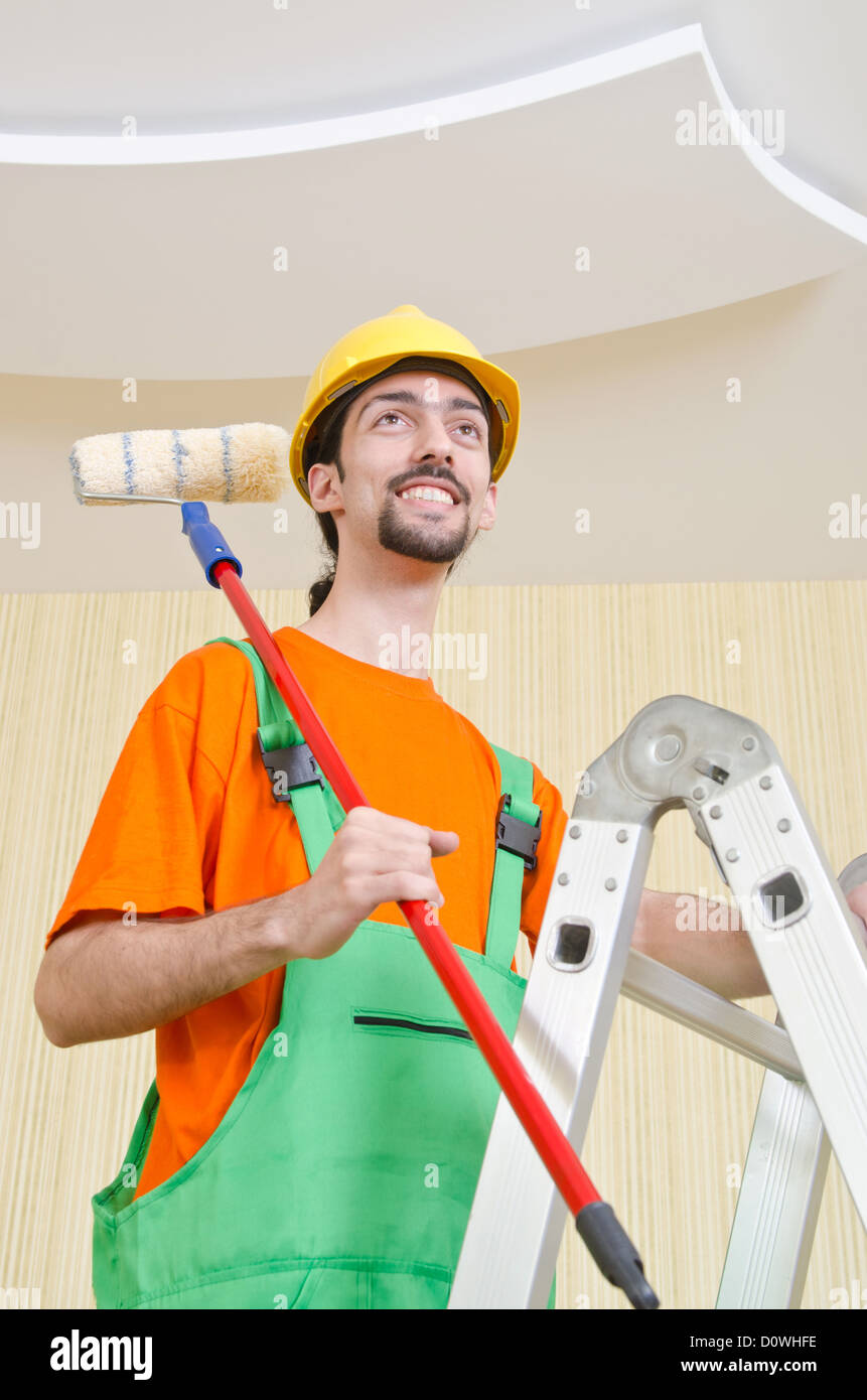 Painter worker during painting job Stock Photo - Alamy