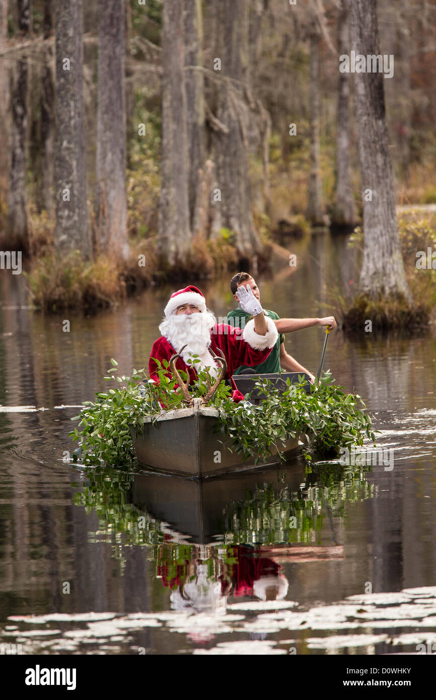 Charleston, USA. 1st December 2012. Santa Claus arrives by swamp boat ...