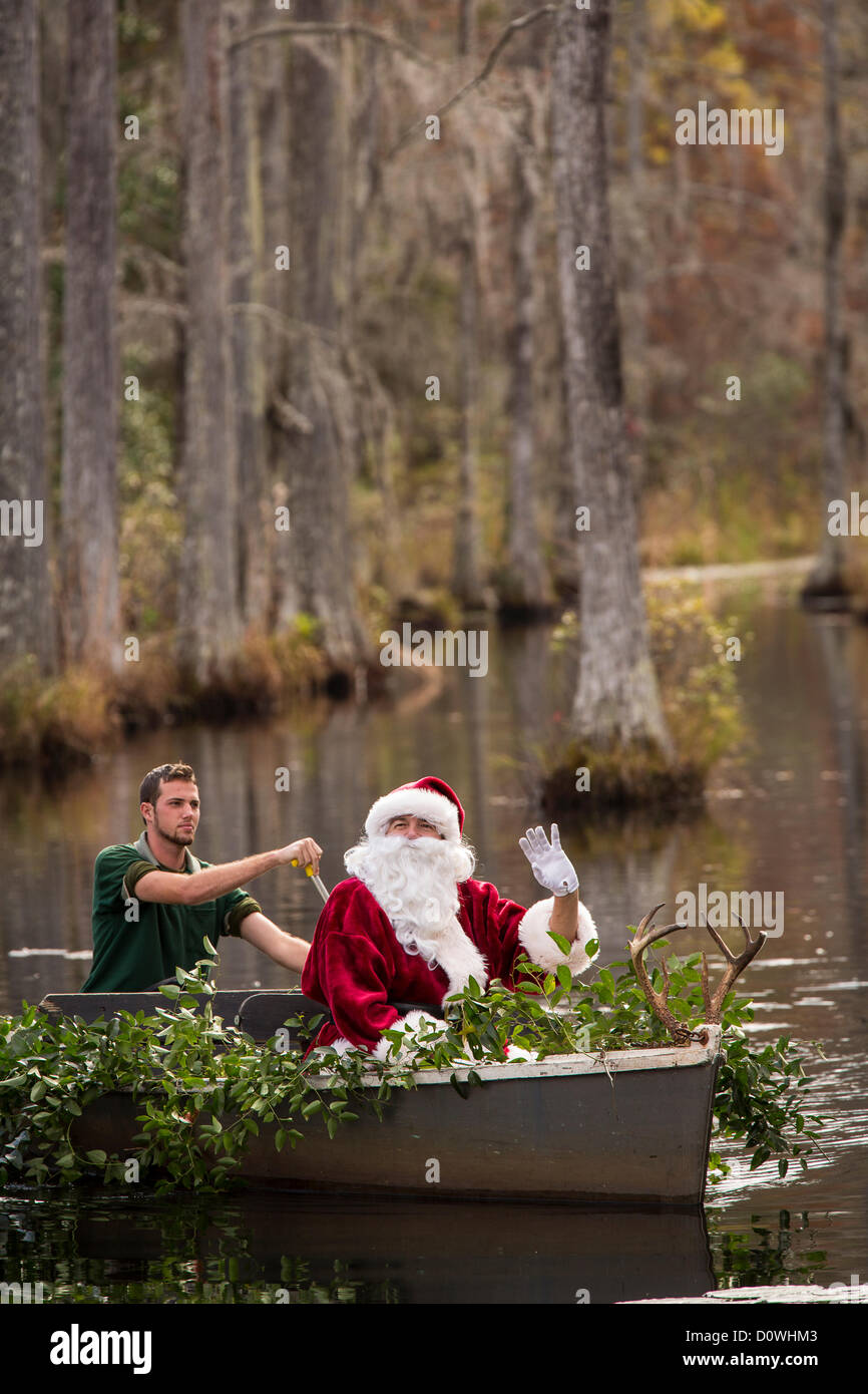 Charleston, USA. 1st December 2012. Santa Claus arrives by swamp boat ...