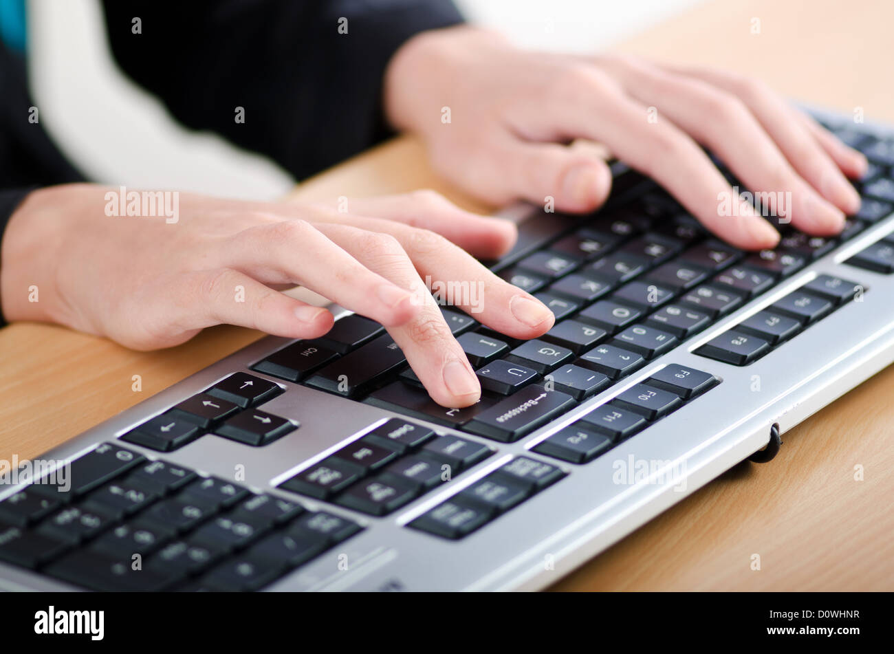 Hands typing on the keyboard Stock Photo - Alamy