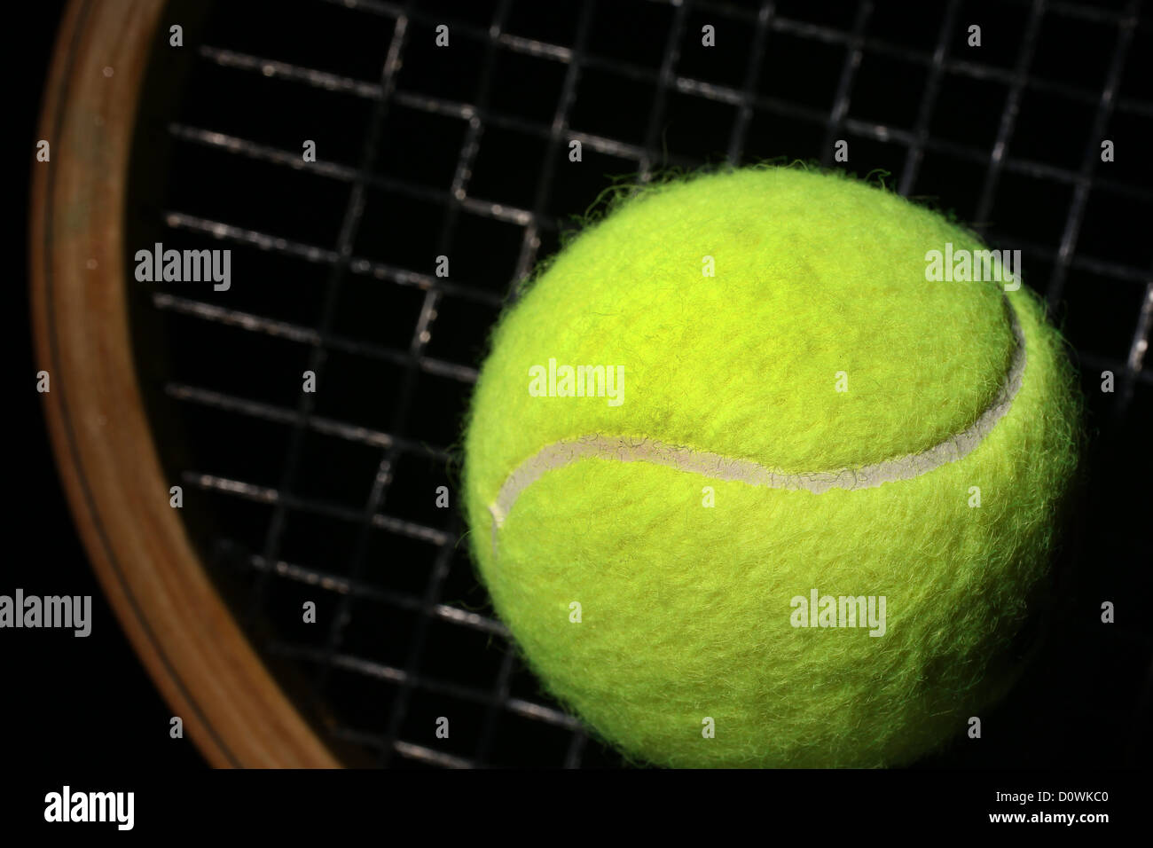 A tennis ball and tennis racquet Stock Photo - Alamy
