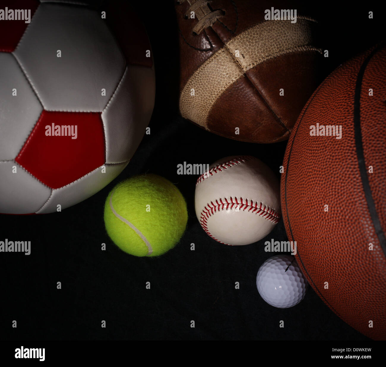 A studio shot of a Baseball, a Basketball an American Football, a ...