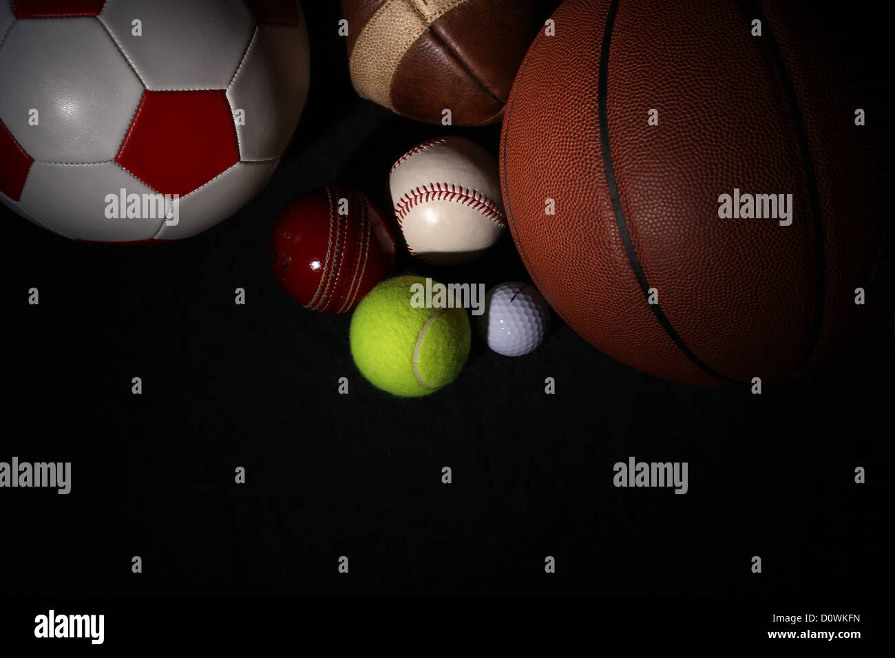 A studio shot of a Baseball, a Basketball an American Football, a ...