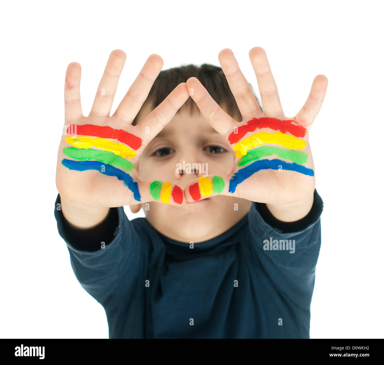 Boy hands painted with rainbow colors. White islated smiling child ...