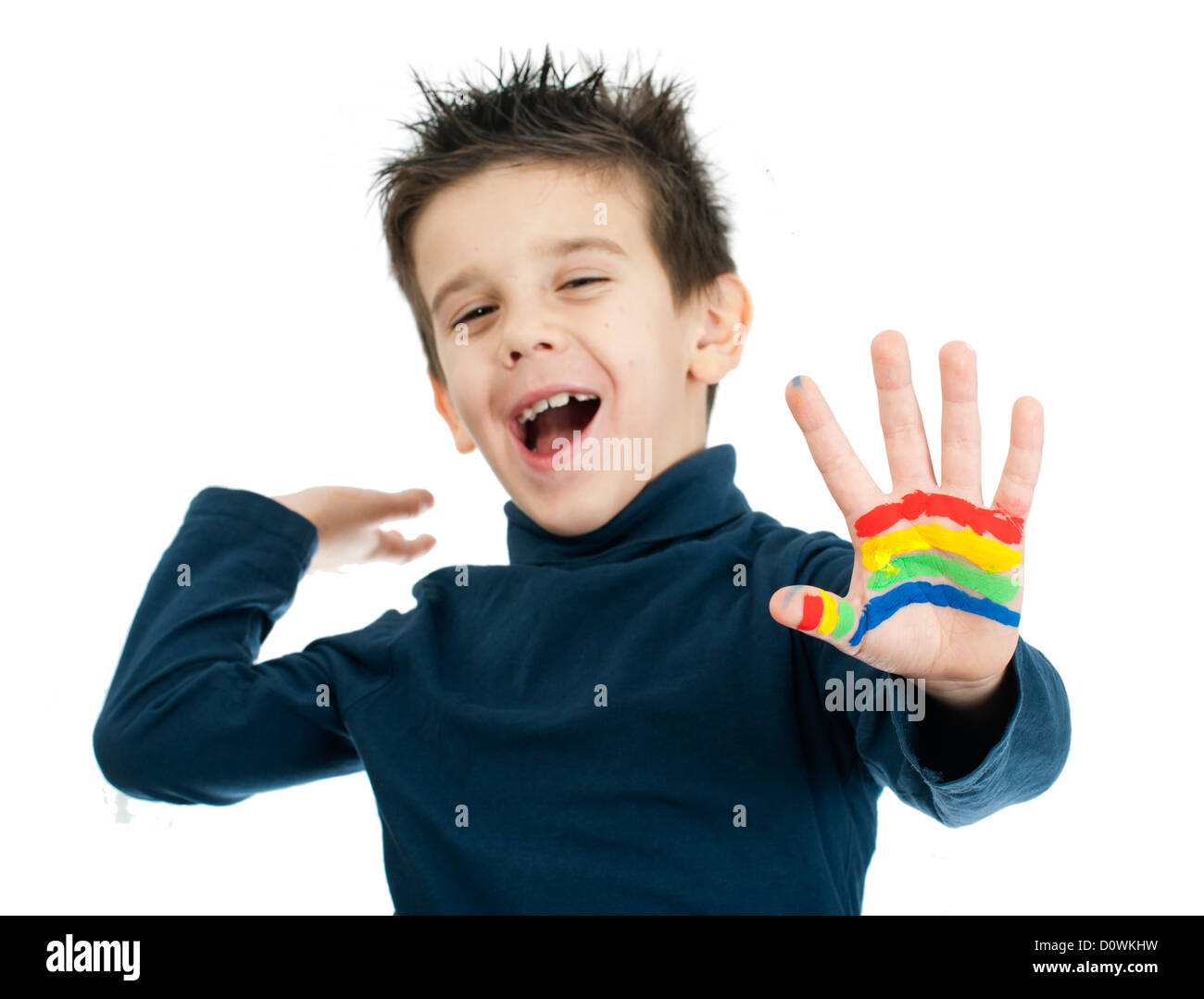 Boy hands painted with rainbow colors. White islated smiling child ...