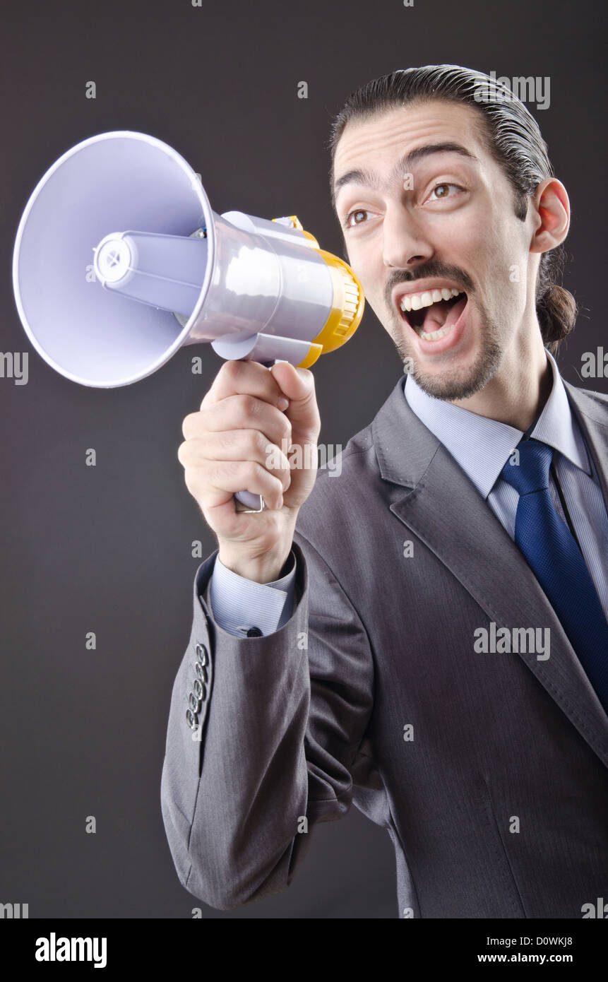 Man shouting and yelling with loudspeaker Stock Photo - Alamy