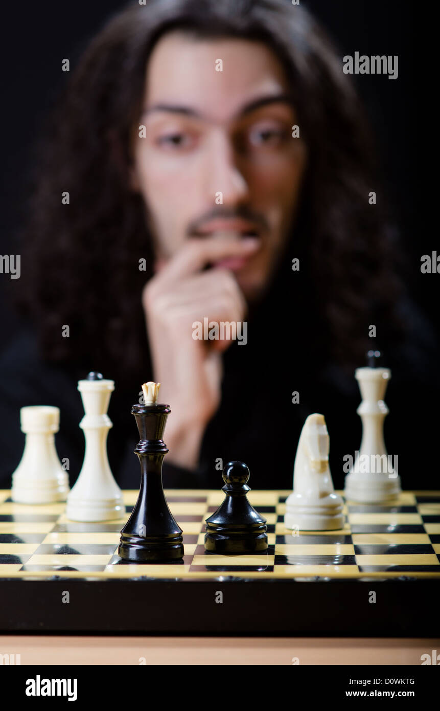 Chess player playing his game Stock Photo - Alamy