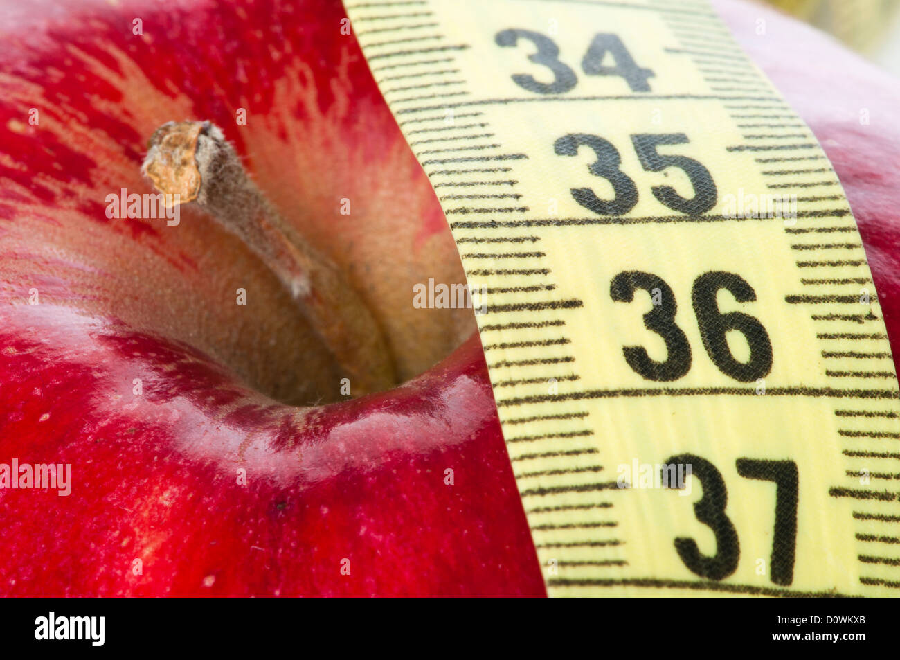 Red apple and centimeter close up Stock Photo - Alamy