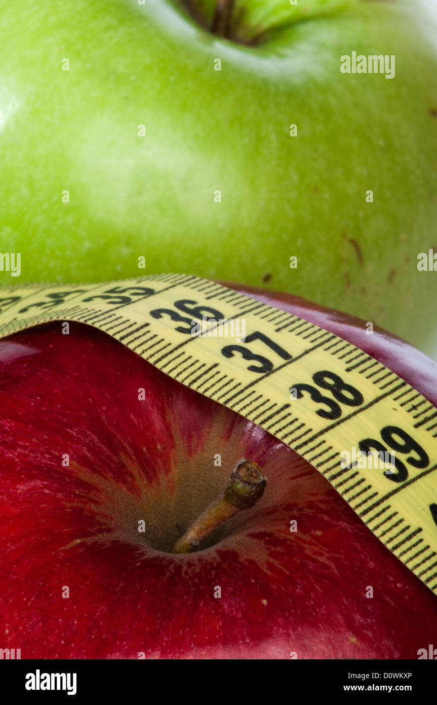 Red and green apple and centimeter close up Stock Photo - Alamy
