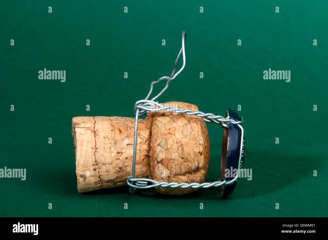 Champagne cork on green background Stock Photo - Alamy