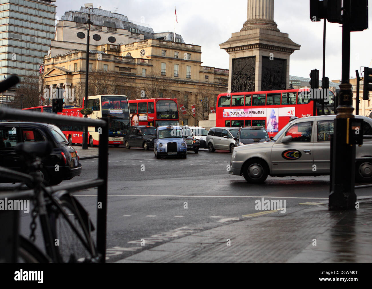 Red buses taxis trafalgar square hi-res stock photography and images ...