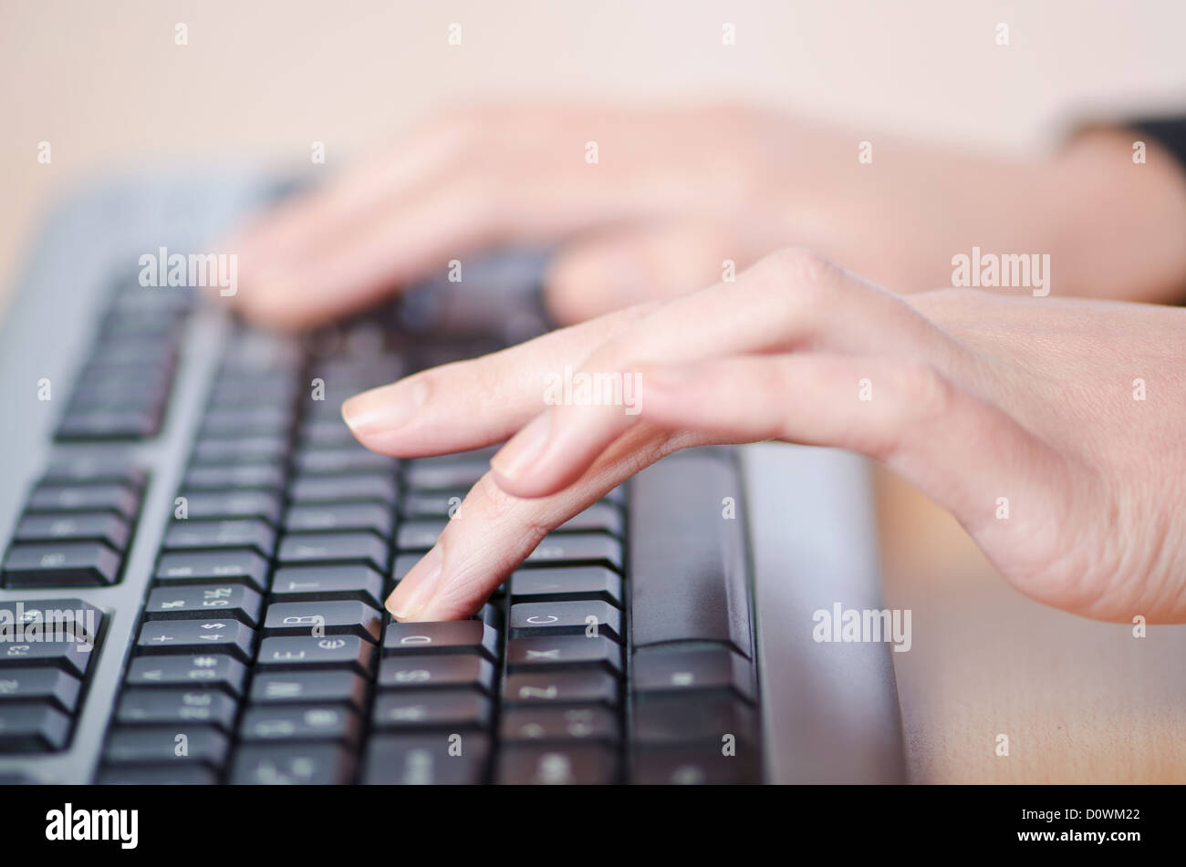 Hands typing on the keyboard Stock Photo - Alamy