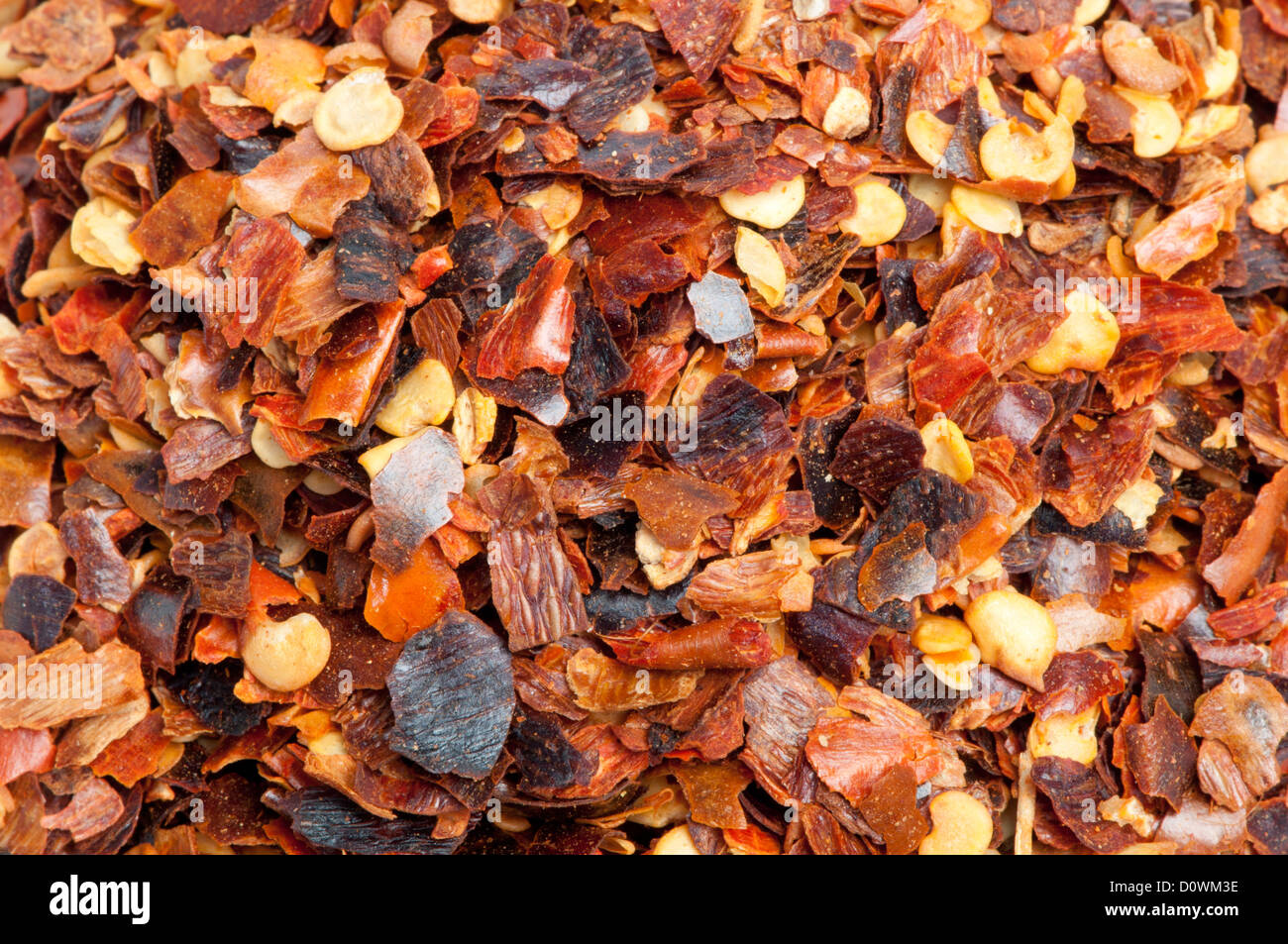 Coarsely ground red pepper background Stock Photo - Alamy