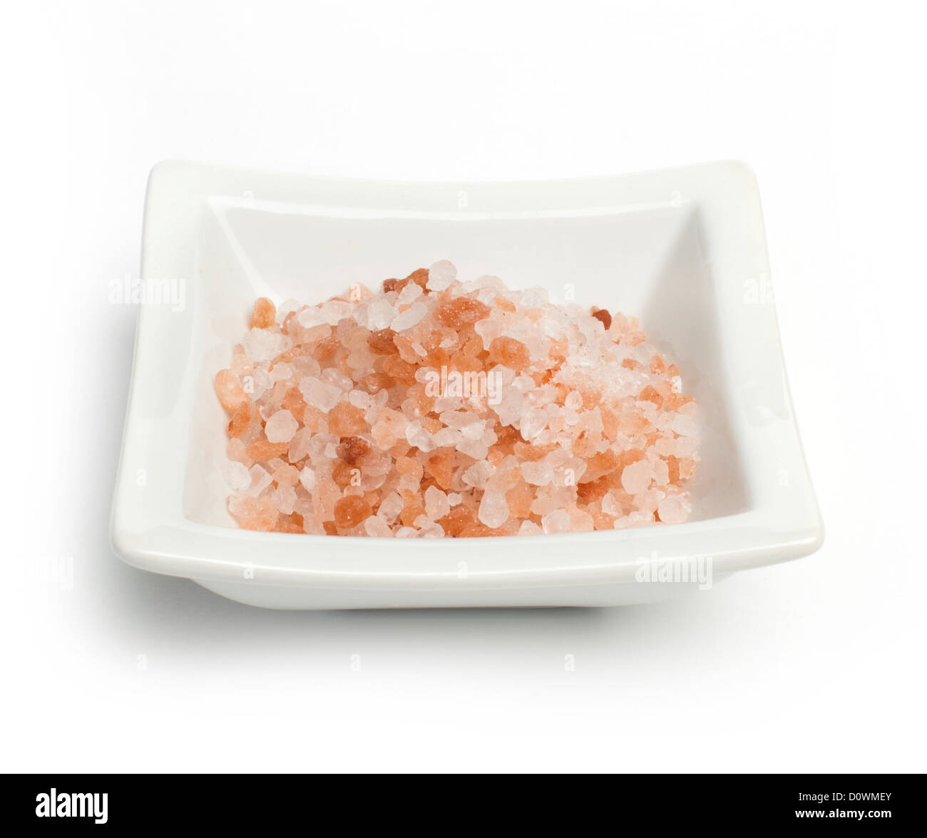 Natural coarse salt in in a bowl white isolated Stock Photo - Alamy