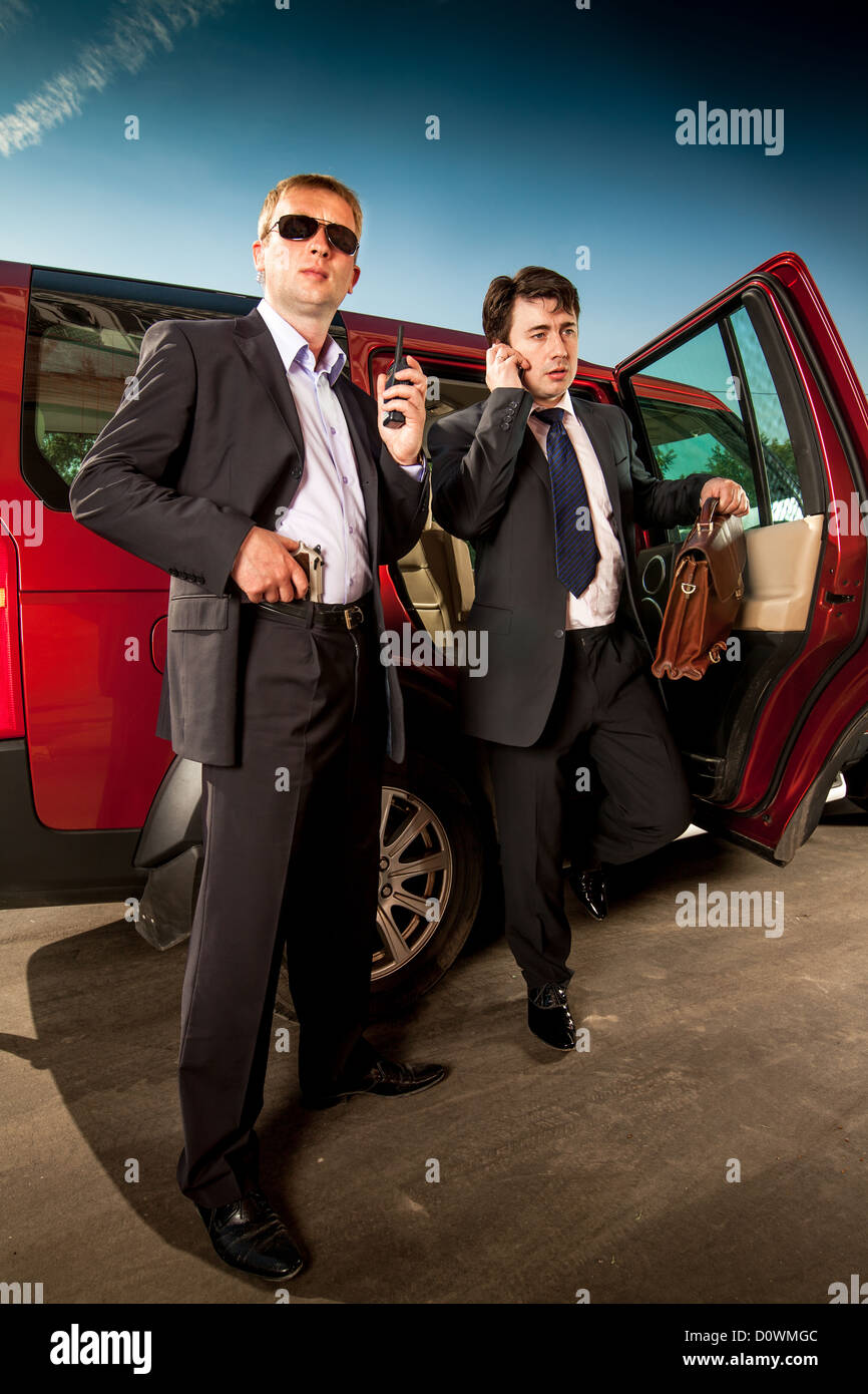 bodyguard and its boss Stock Photo - Alamy