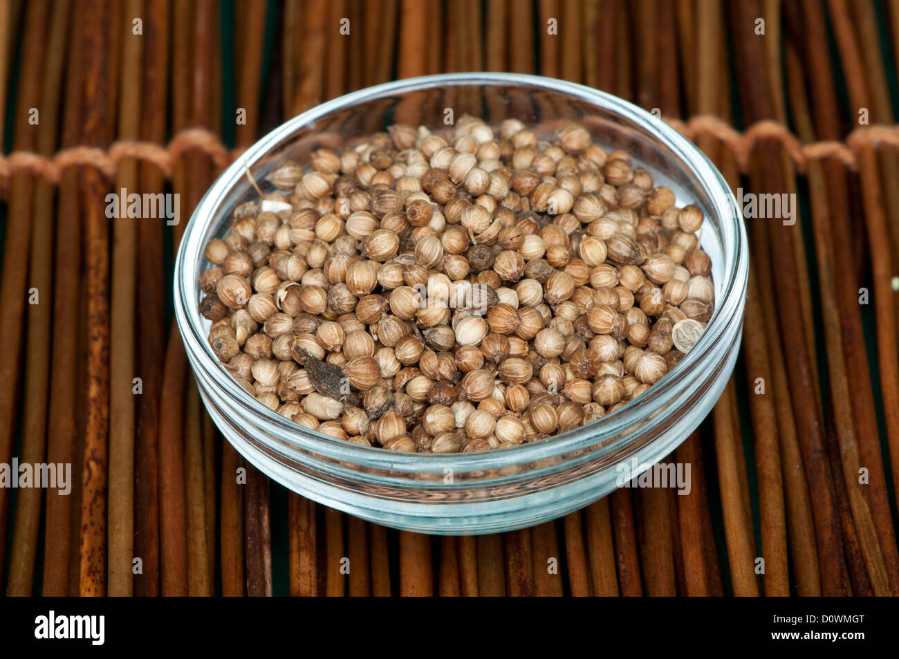 Dried coriander in a bowl on wooden base Stock Photo - Alamy