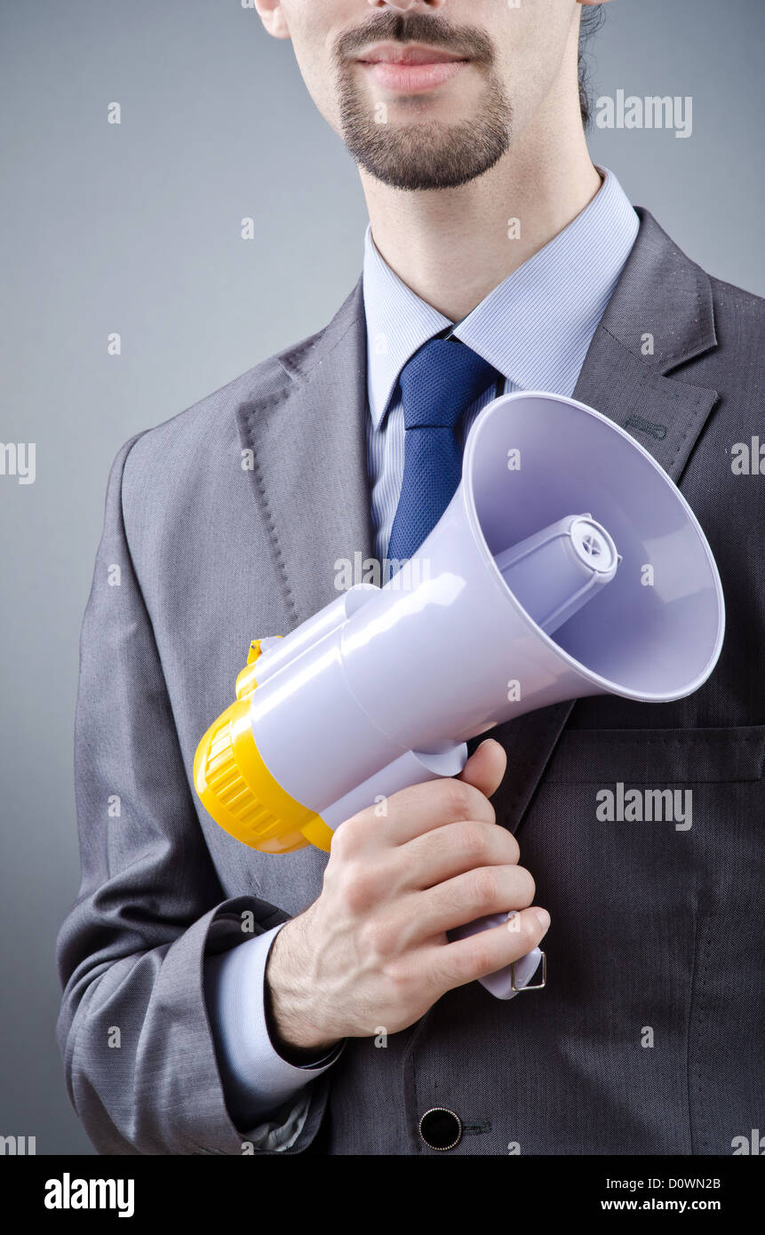 Man shouting and yelling with loudspeaker Stock Photo - Alamy