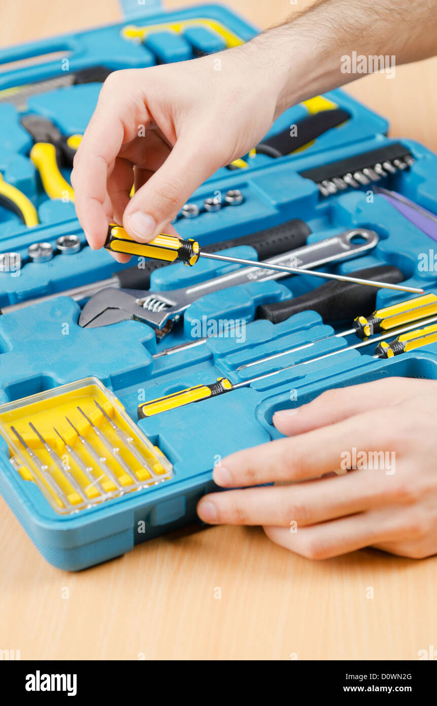 Repairman with his toolkit Stock Photo - Alamy