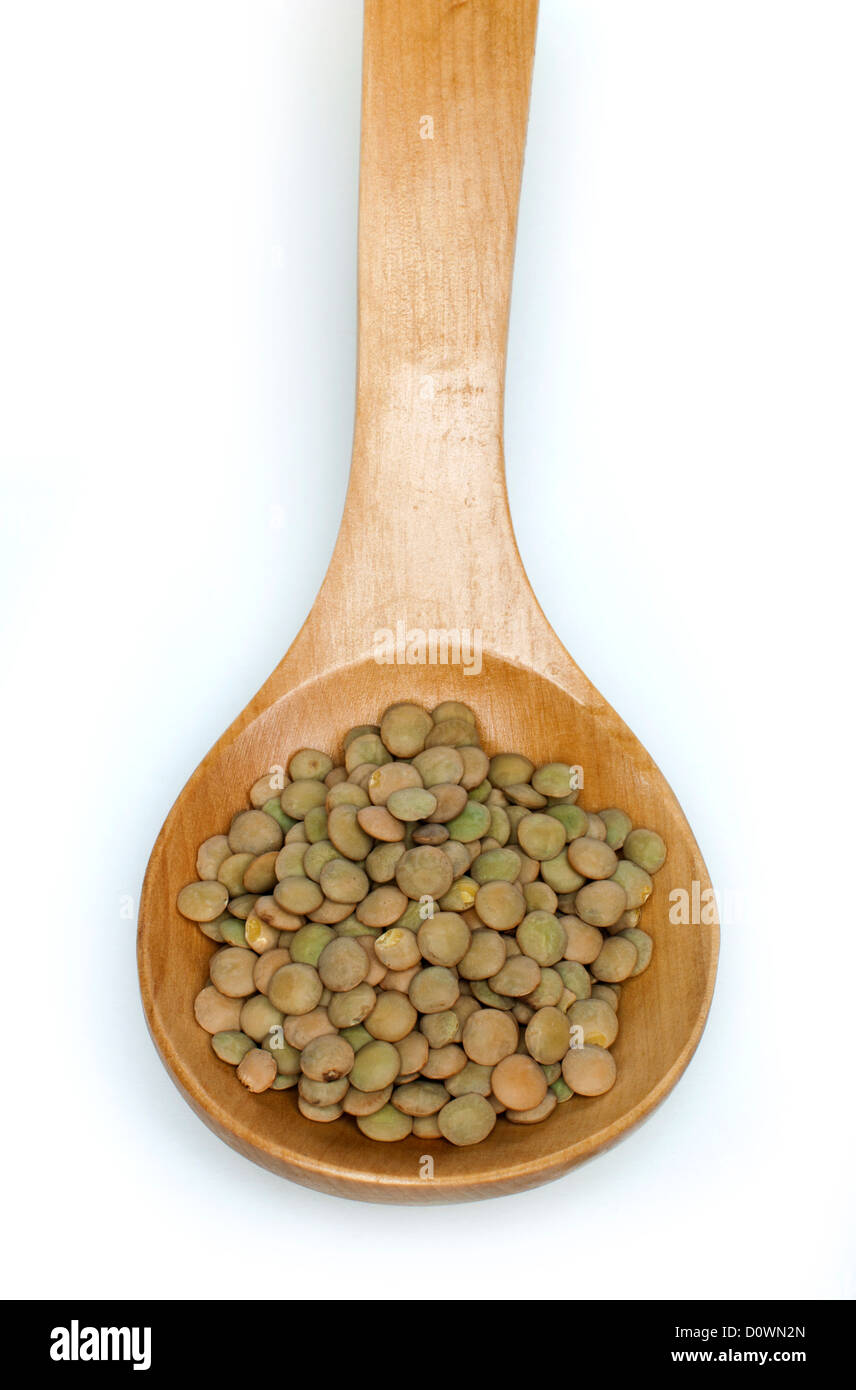 Lentil canada in wooden spoon on white background Stock Photo - Alamy