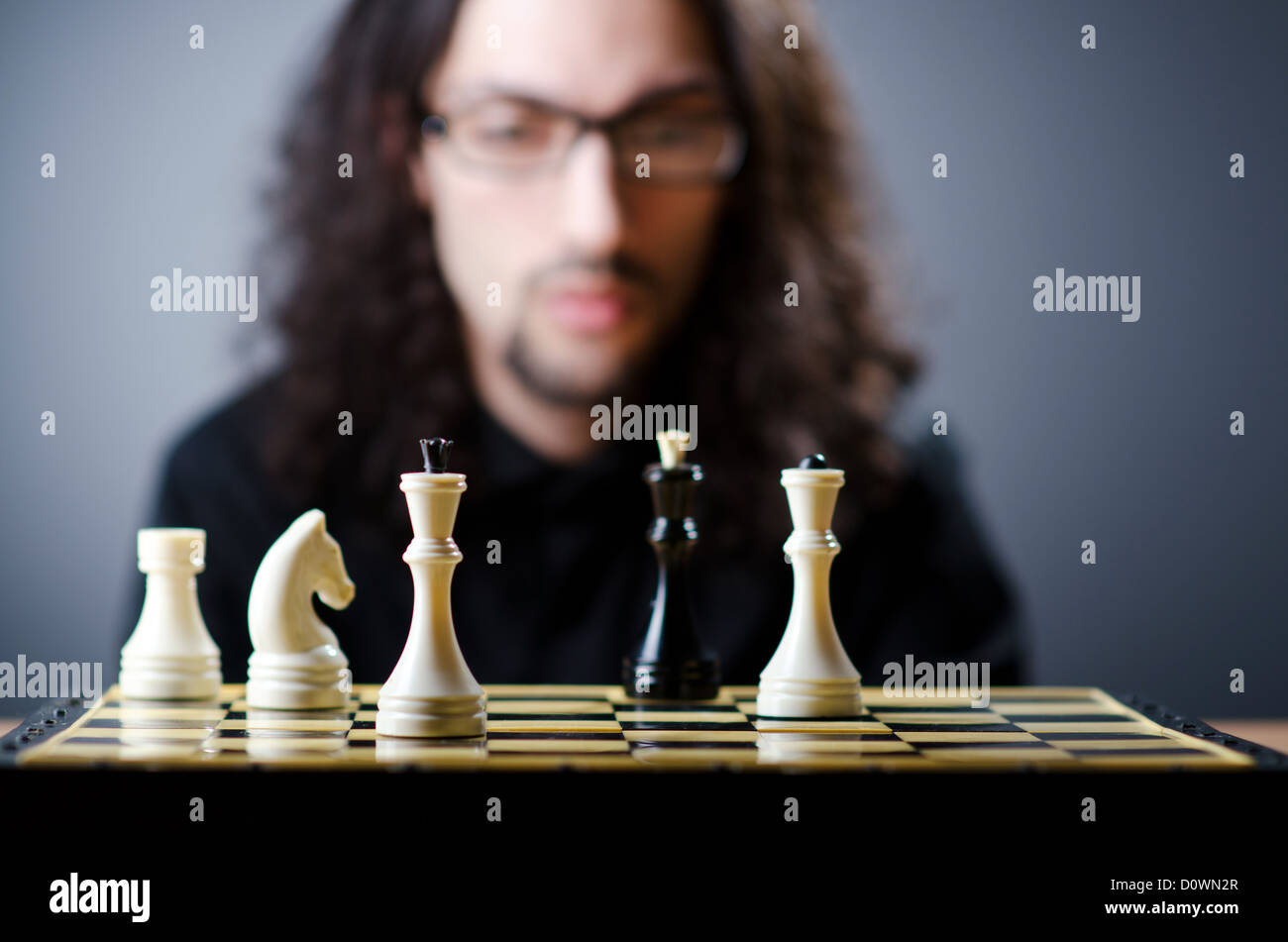 Chess player playing his game Stock Photo - Alamy
