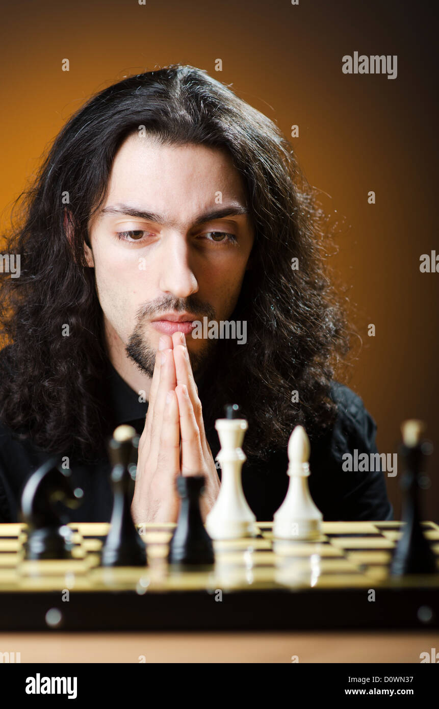 Chess player playing his game Stock Photo - Alamy