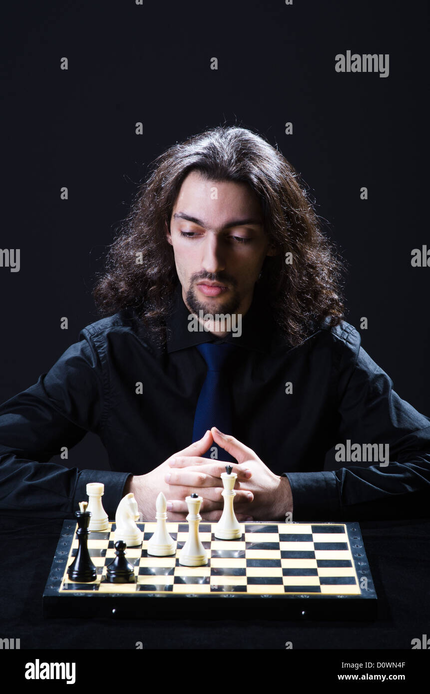 Chess player playing his game Stock Photo - Alamy