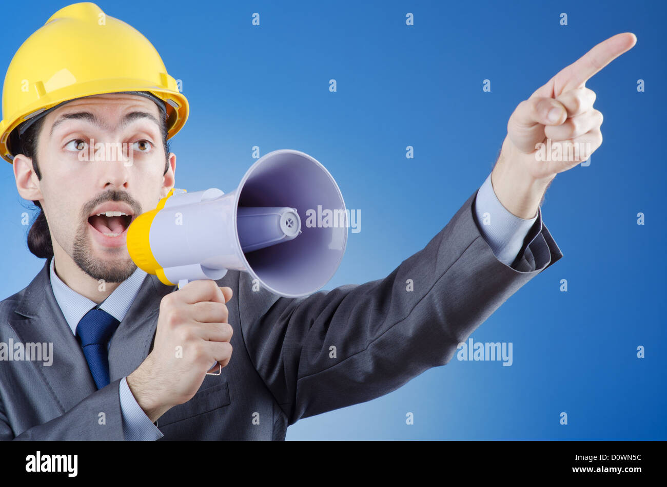 Construction worker shouting via loudspeaker Stock Photo - Alamy
