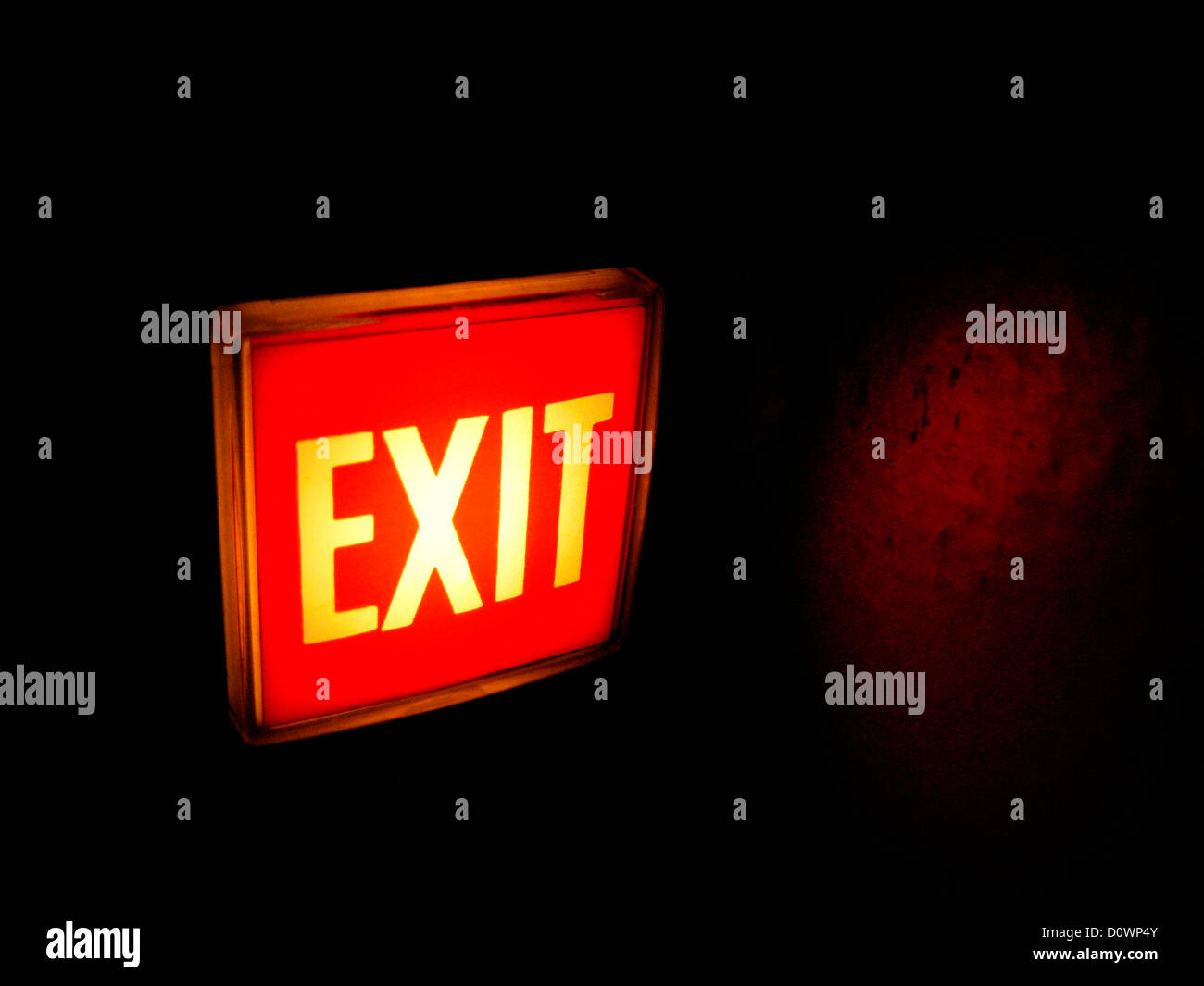 an Exit sign hangs in an apartment house hallway in Astoria, Queens NY ...