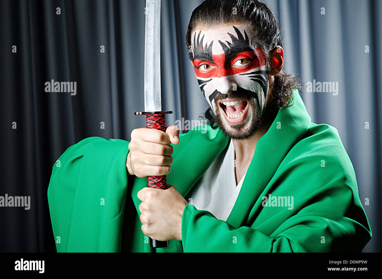 Man with face mask and sword Stock Photo - Alamy
