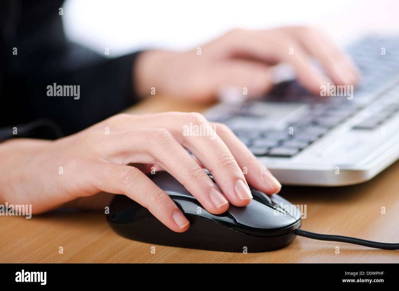 Hands typing on the keyboard Stock Photo - Alamy