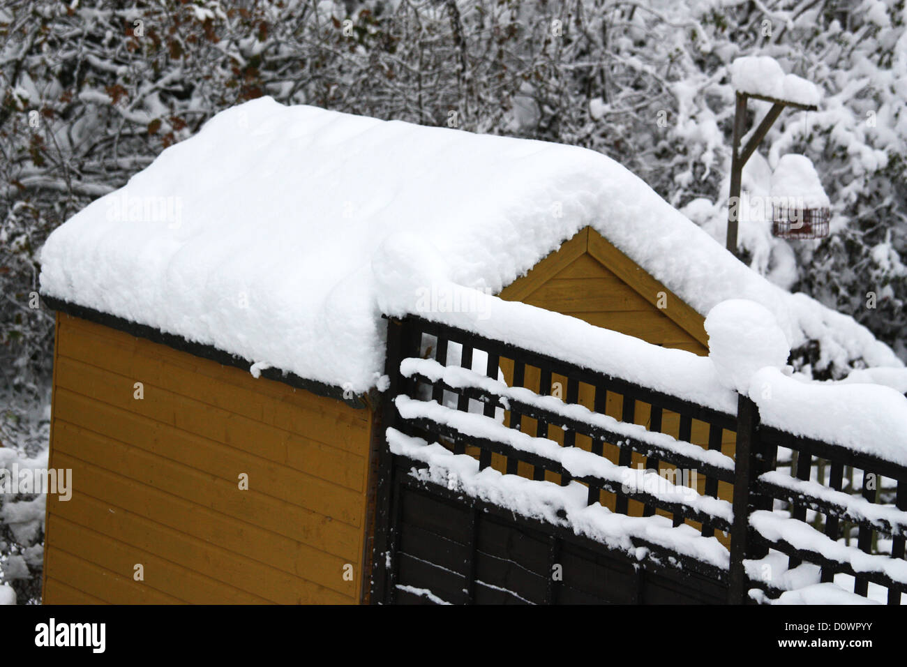 Snow covered garden house with fence Stock Photo - Alamy