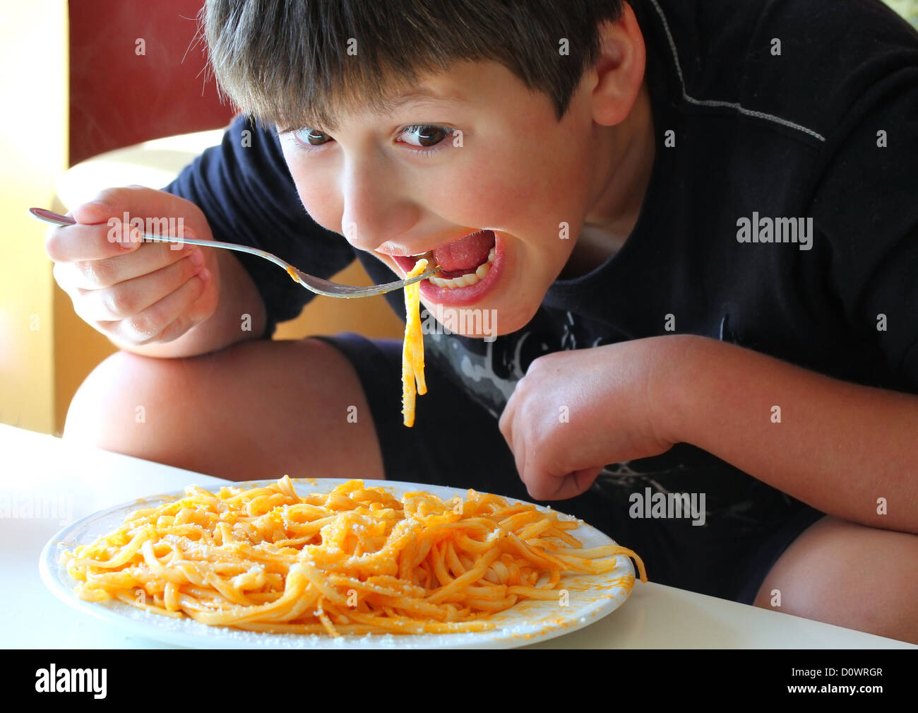 Boy eating messy spaghetti dinner hi-res stock photography and images ...