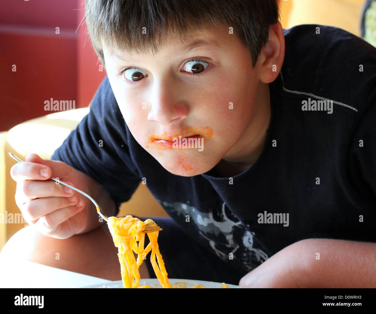 Boy eating messy spaghetti dinner hi-res stock photography and images ...