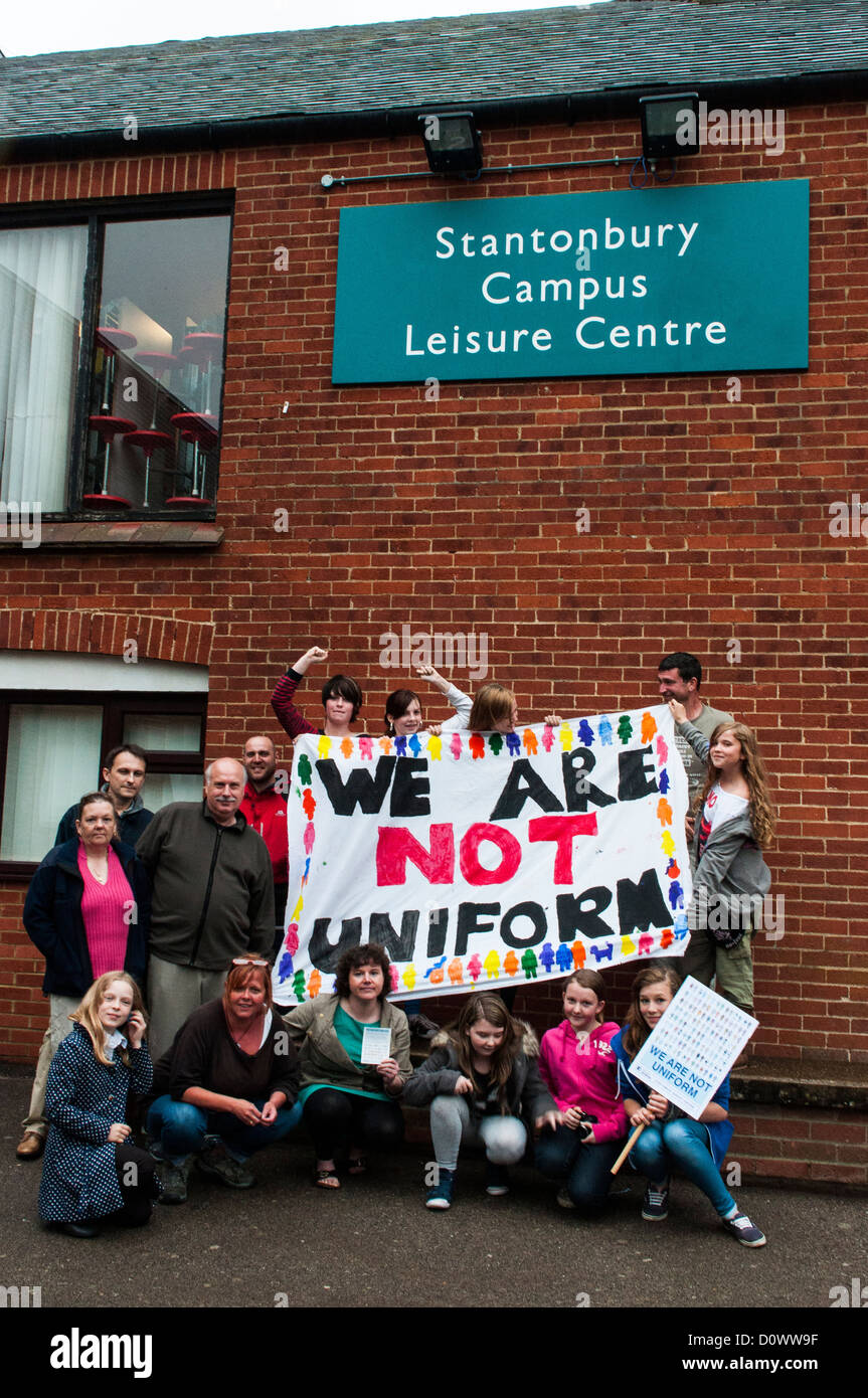 School students and parents protest the introduction of uniform at ...