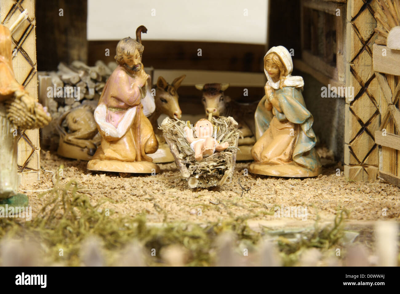 Crib with the nativity scene with figurines Stock Photo - Alamy