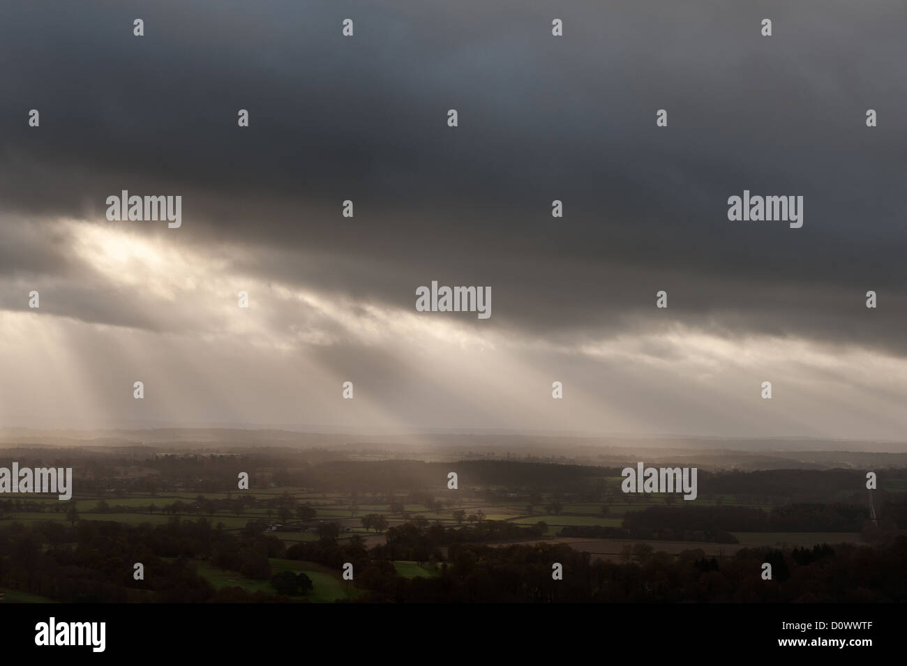 Dramatic winter sunshine low angle of sun at sunrise passing through ...