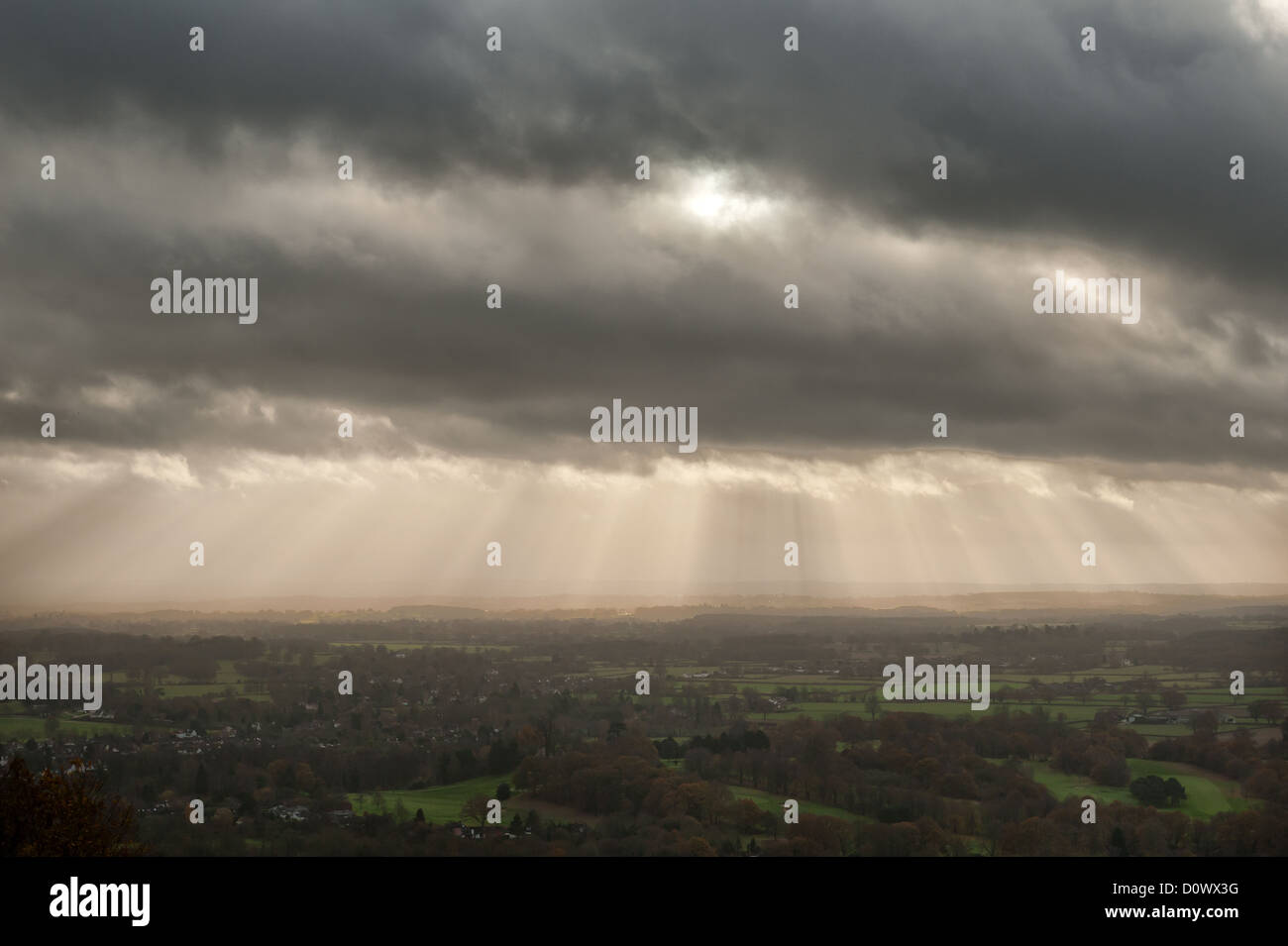 Dramatic winter sunshine low angle of sun at sunrise passing through ...