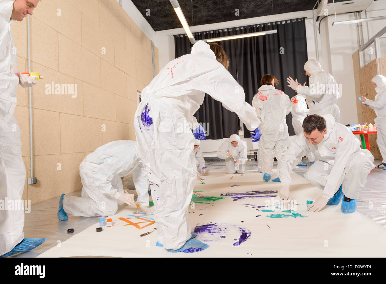People having fun during art therapy session drawing paint Stock Photo ...
